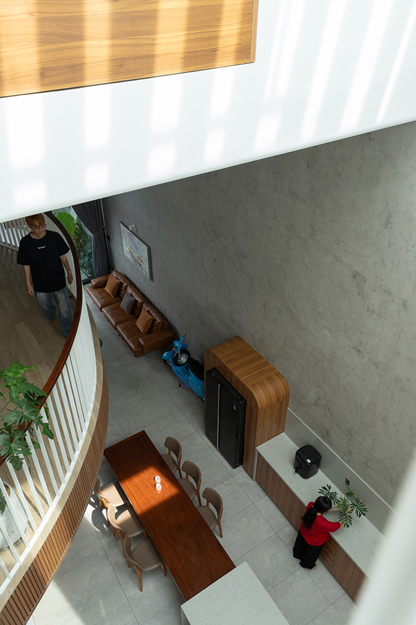 vespa-inspired curved geometry shapes vietnam residence clad in wood