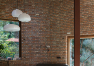 BLAF architects uses recycled bricks to build curved 'gjG house' in belgium