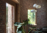 BLAF architects uses recycled bricks to build curved 'gjG house' in belgium