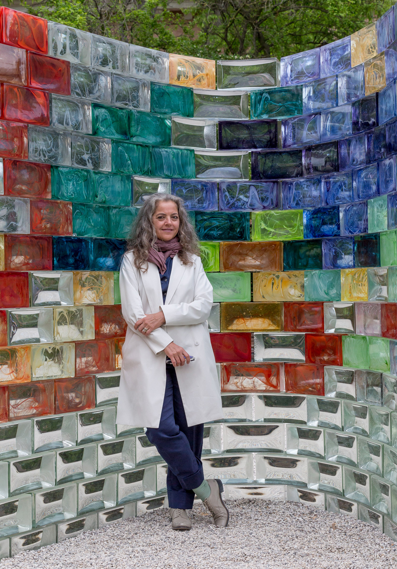 pae white creates a curving wall of colored glass for le stanze del vetro