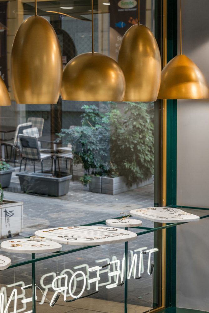 bold green with a touch of gold: urban soul project's jewelry store in ...