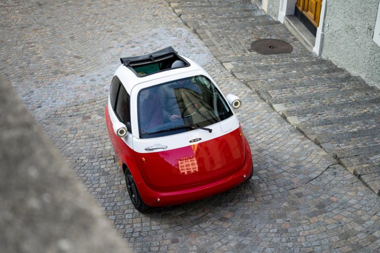 small, electric microlino car soon to be driving along european streets