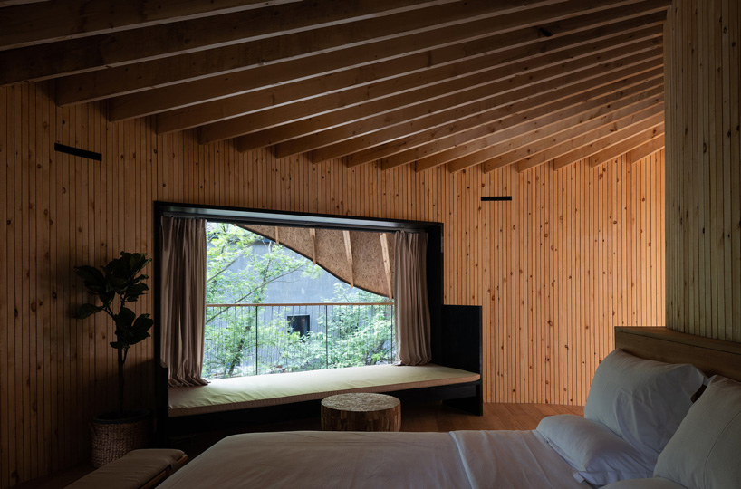 a curved roof dictates the circular sequence of spaces in this ...