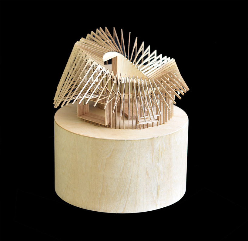 a curved roof dictates the circular sequence of spaces in this ...