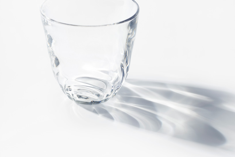 nendo creates glass bottle capturing the ripples of natural spring water