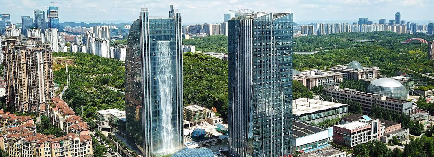 watch: 100 meter waterfall cascades off a skyscraper in china