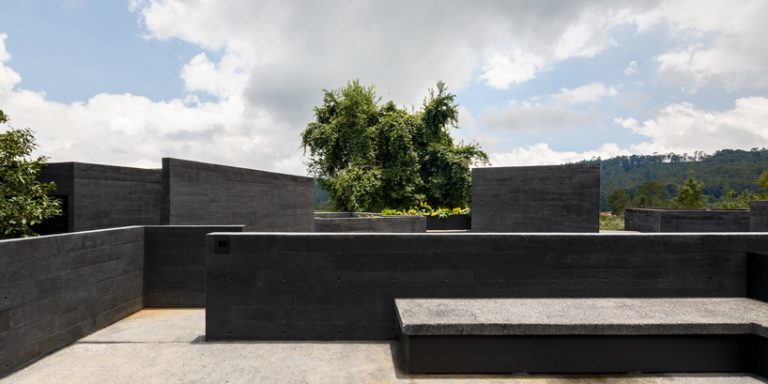 nine individual blocks compose the black concrete bruma house in mexico ...