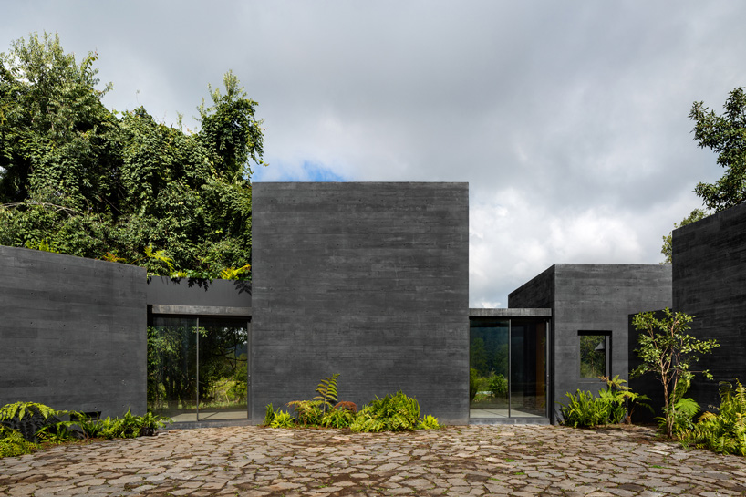 nine individual blocks compose the black concrete bruma house in mexico ...