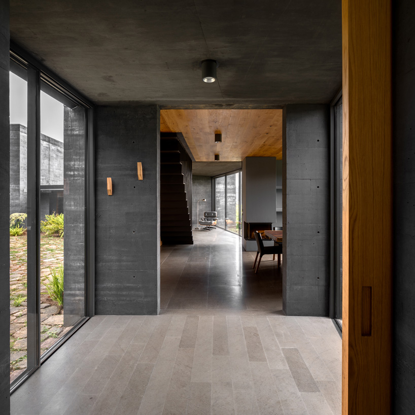 nine individual blocks compose the black concrete bruma house in mexico ...