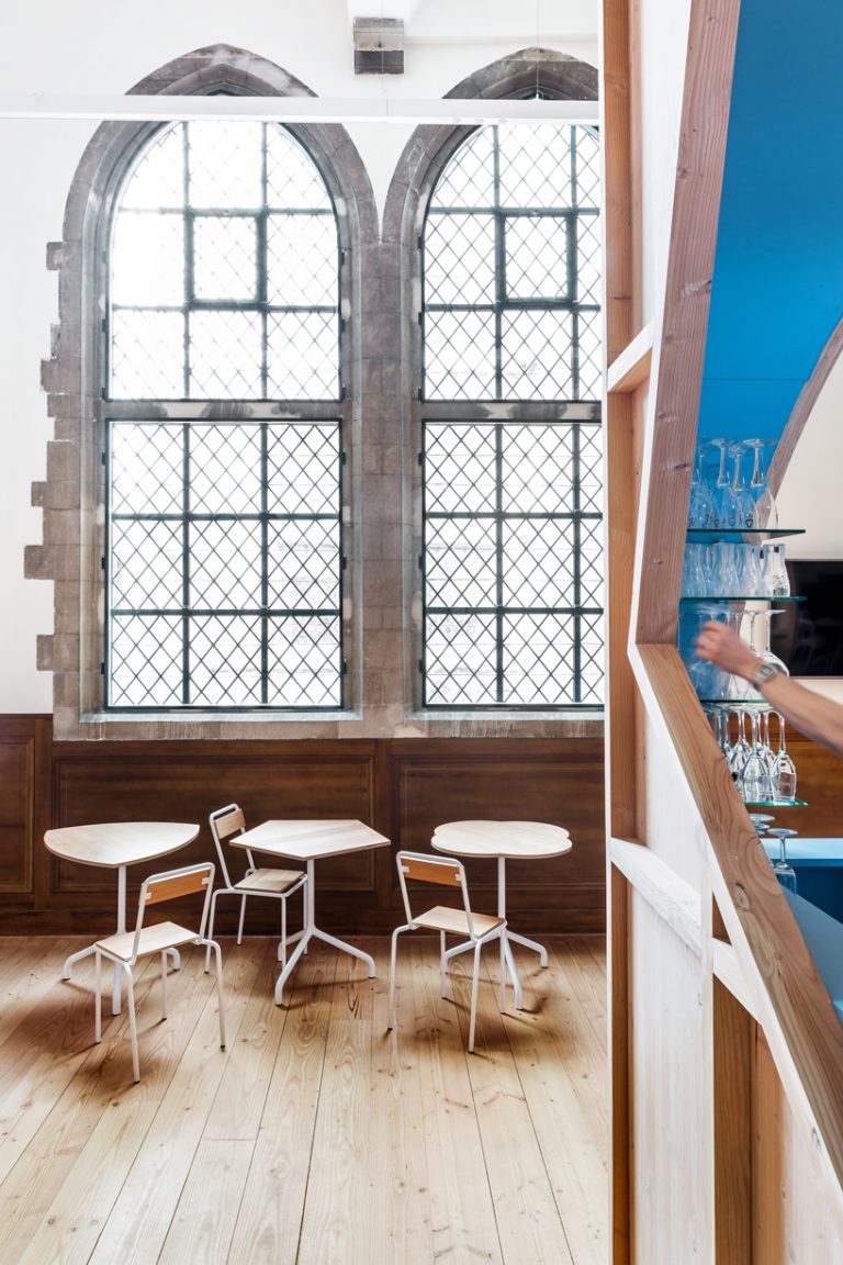 a contemporary gothic bar occupies belgium's largest cathedral