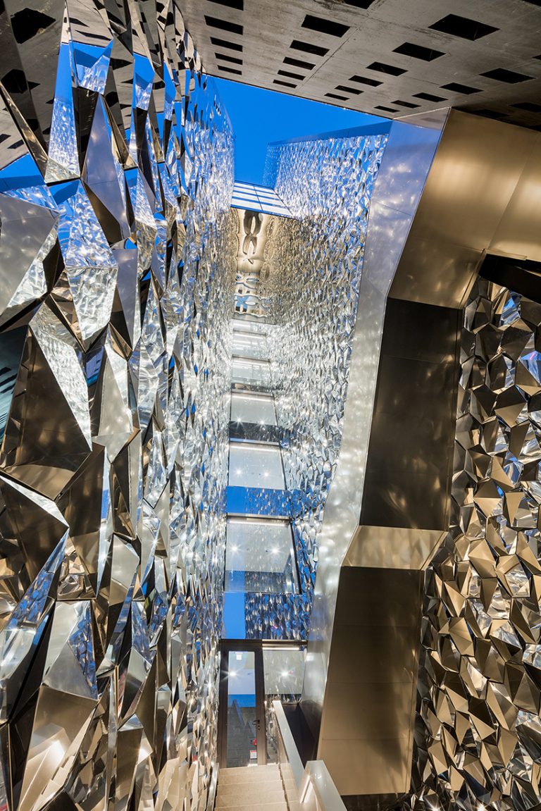 OBBA juxtaposes reflective panels with concrete for office tower in seoul