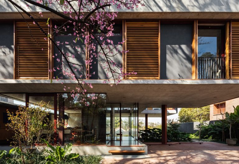 villa lobos by una arquitetos is surrounded by gardens