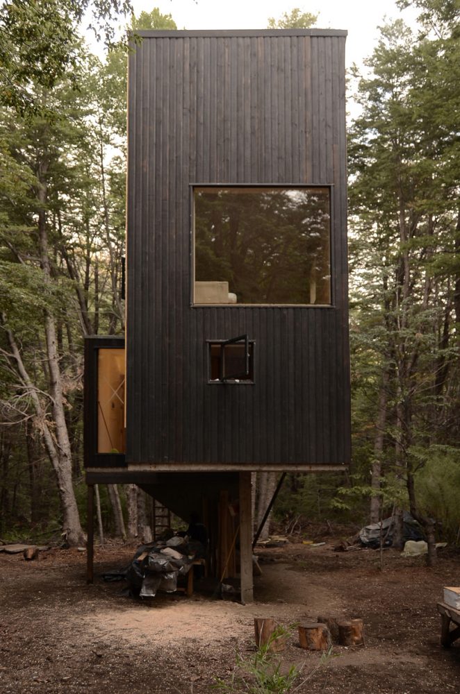 DRAA nestles a charred timber cabin in the woodlands of chile