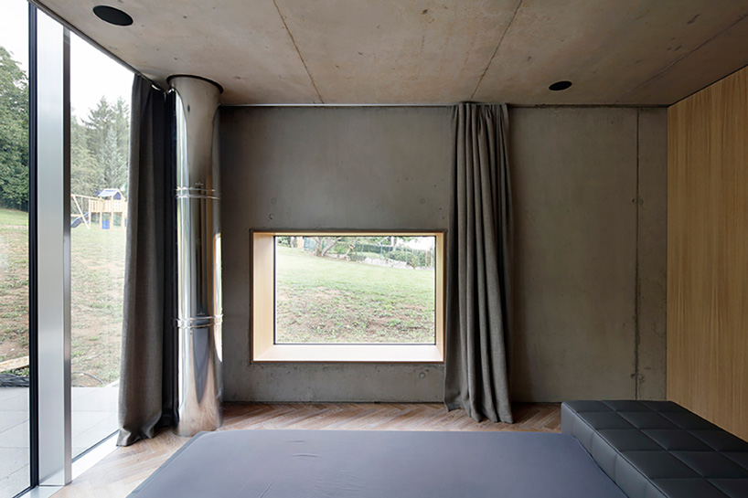 single-family house by 2001 juts like a concrete monolith from the ground