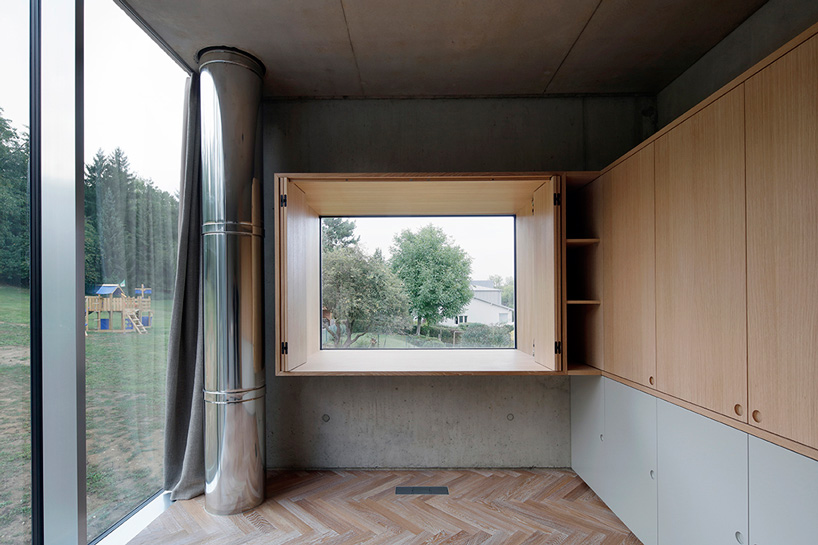 single-family house by 2001 juts like a concrete monolith from the ground