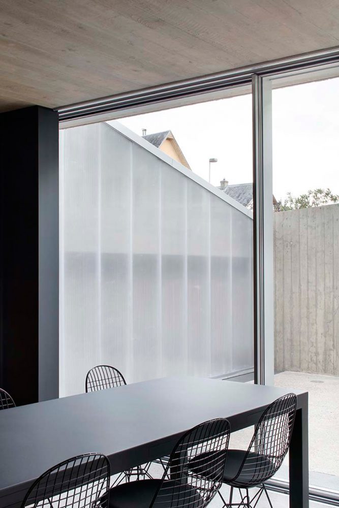 single-family house by 2001 juts like a concrete monolith from the ground