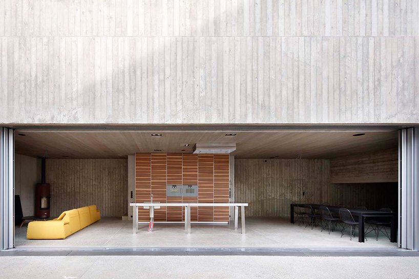 single-family house by 2001 juts like a concrete monolith from the ground