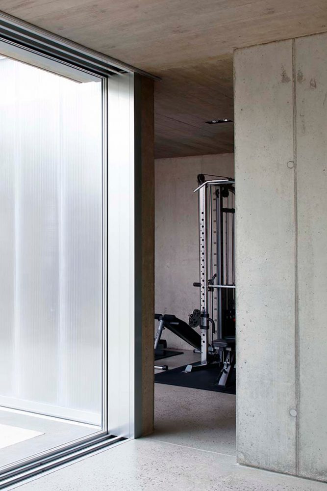 single-family house by 2001 juts like a concrete monolith from the ground