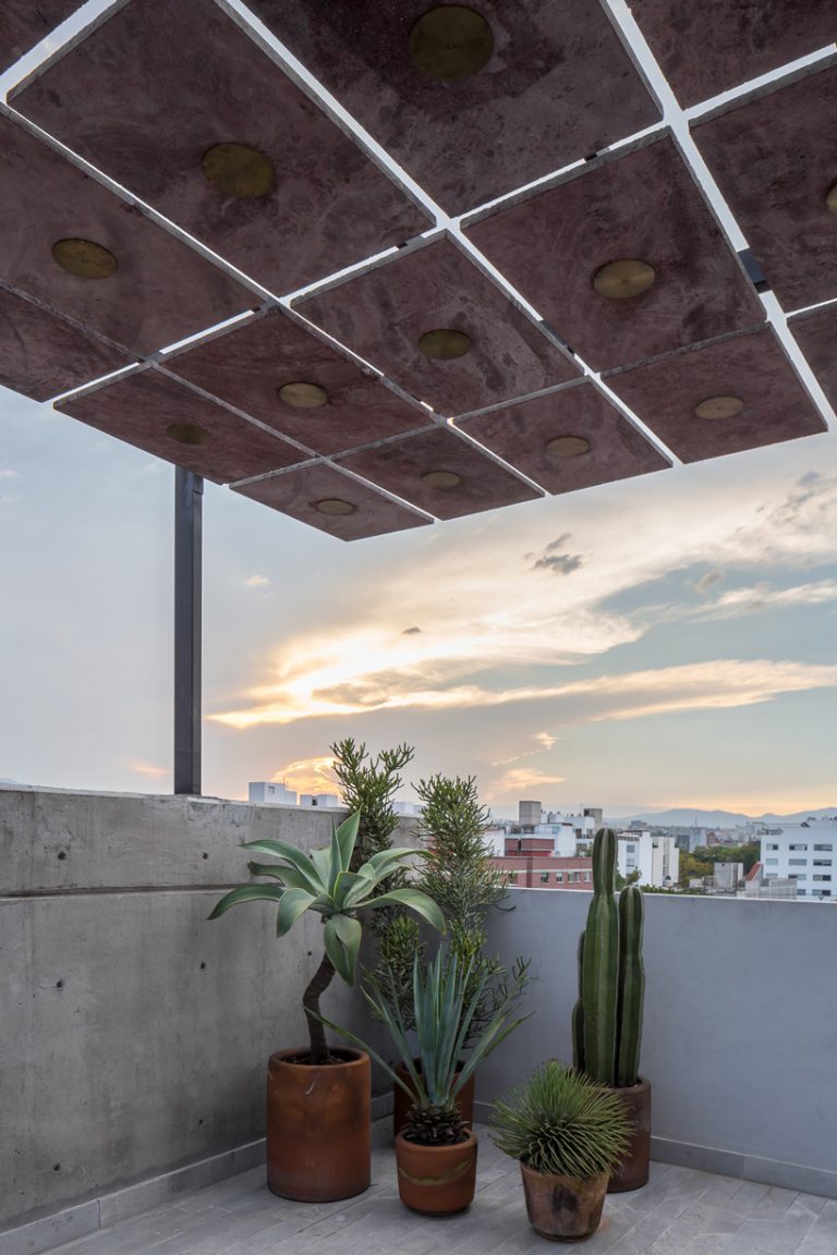 PALMA suspends grid of volcanic stone over mexico city terrace