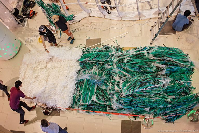 168,000 used straws were artfully repurposed into two crashing waves of ...