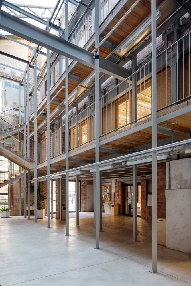 restoration by HARQUITECTES expresses heritage building's structural memory