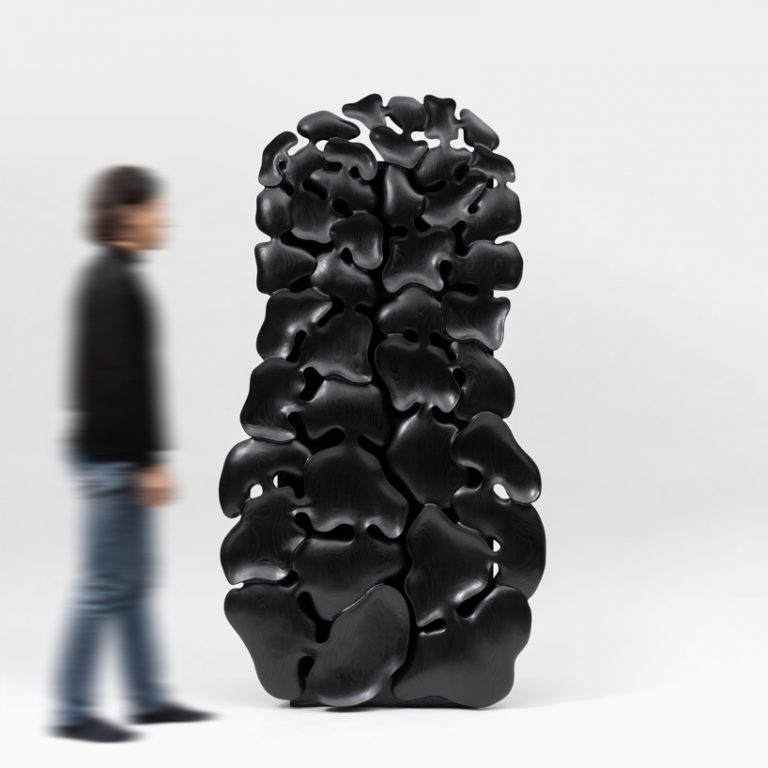 kim yun-hwan composes furniture pieces using hand-carved wood