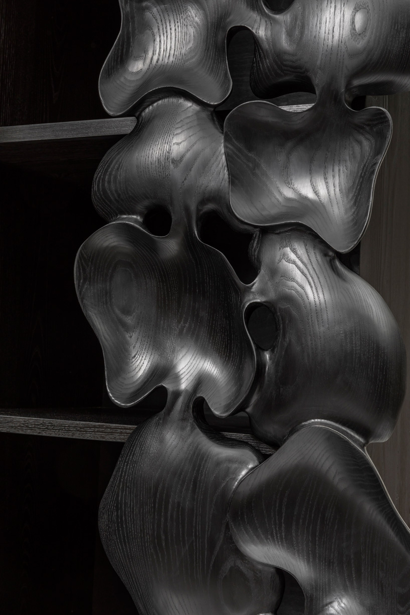 kim yun-hwan composes furniture pieces using hand-carved wood