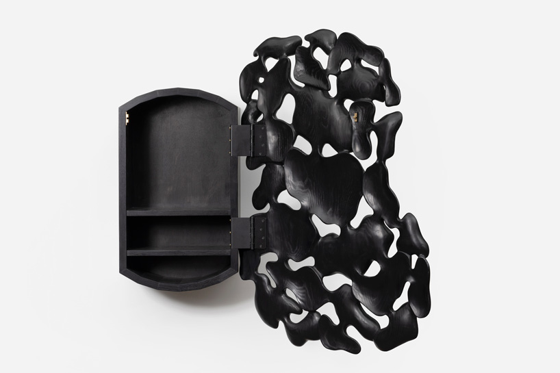 kim yun-hwan composes furniture pieces using hand-carved wood