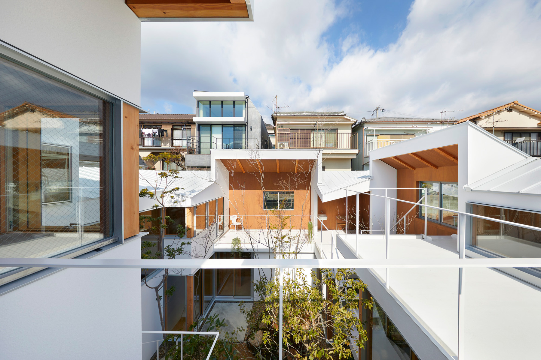 tomohiro hata blurs the boundaries of the loop terrace house in japan