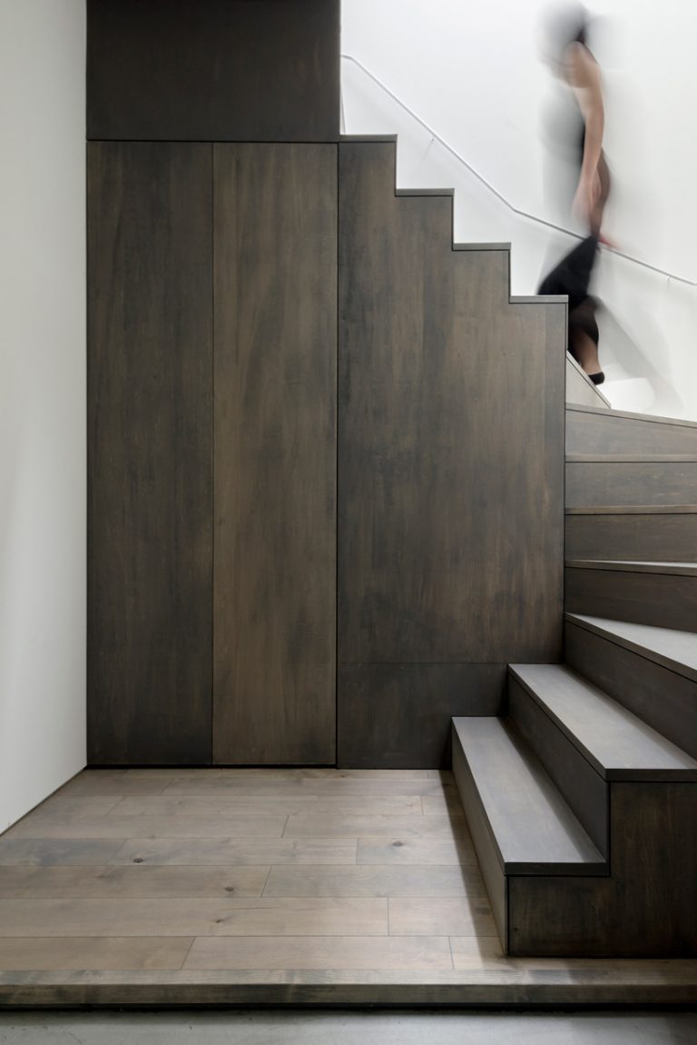 curved building by jun igarashi architects doubles as store and residence