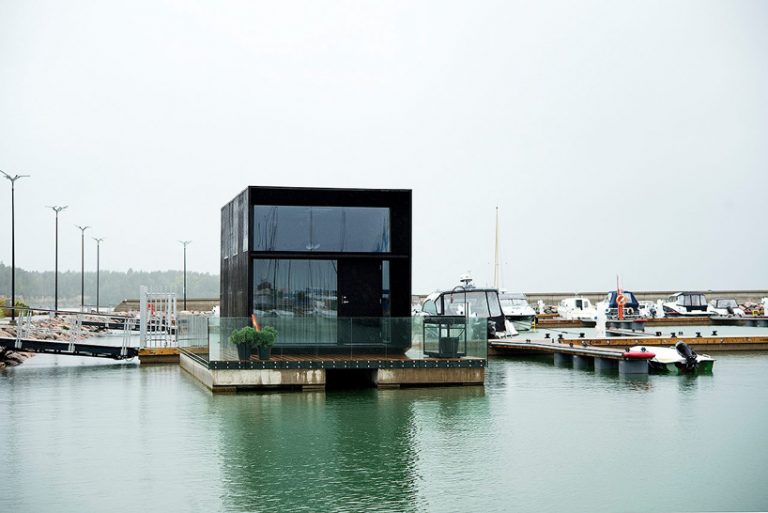 kodasema's tiny prefab house floats on water through integrated pontoons