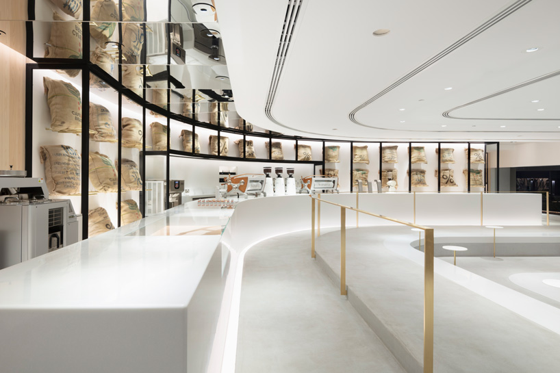 nendo designs stair-like interior for arabica coffee branch in kuwait