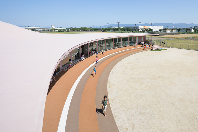 ryuji fujimura tops subaru nursery school in japan with curved concrete ...