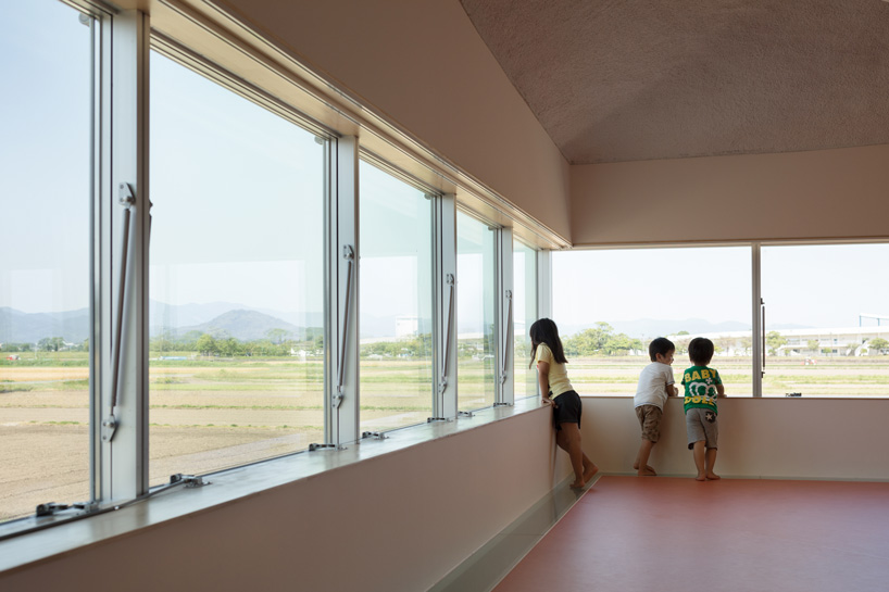 ryuji fujimura tops subaru nursery school in japan with curved concrete ...