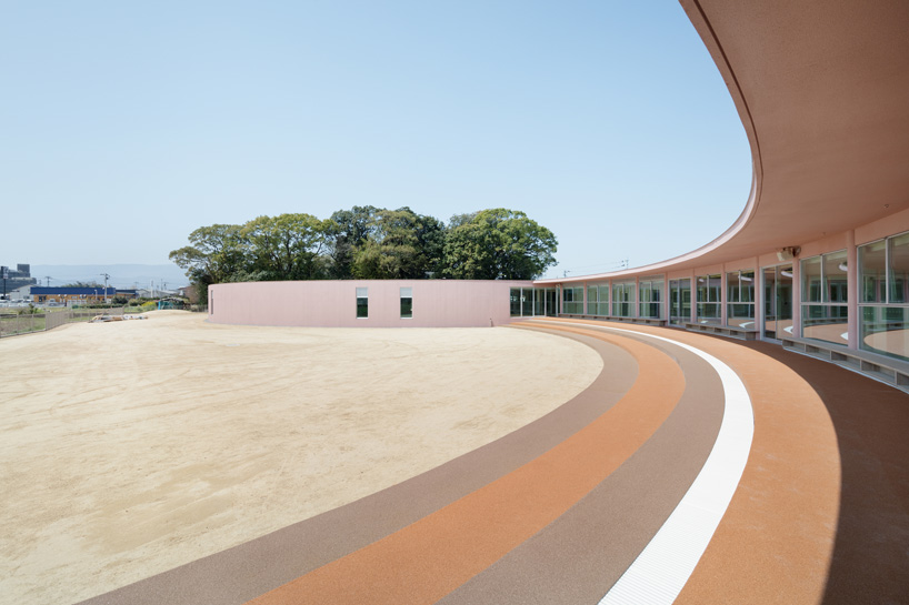 ryuji fujimura tops subaru nursery school in japan with curved concrete ...