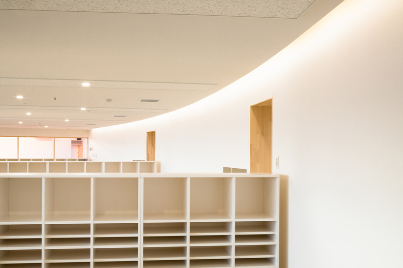 ryuji fujimura tops subaru nursery school in japan with curved concrete ...