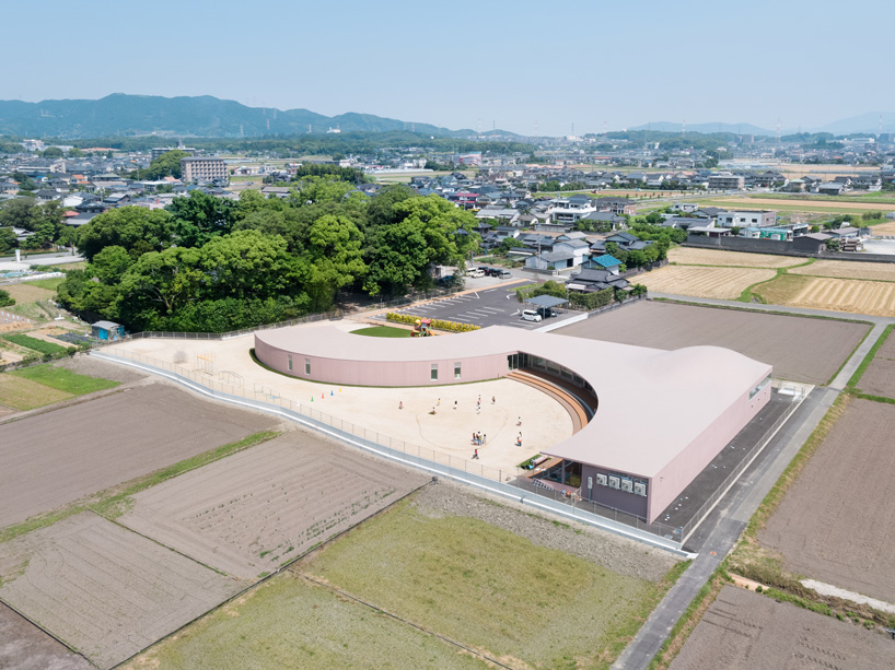 ryuji fujimura tops subaru nursery school in japan with curved concrete ...