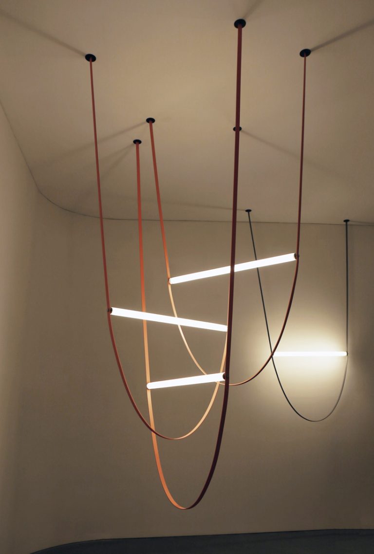 pinball corridor introduces visitors to flos' booth at salone del mobile