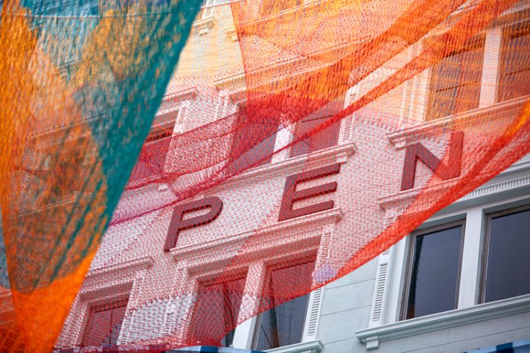 janet echelman's ethereal net sculpture floats above streets of hong kong