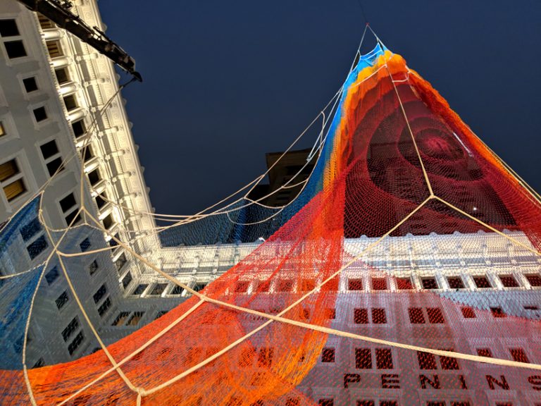 janet echelman's ethereal net sculpture floats above streets of hong kong