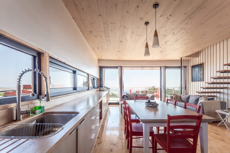 a detached latticed structure wraps around tacna house by par arquitectos