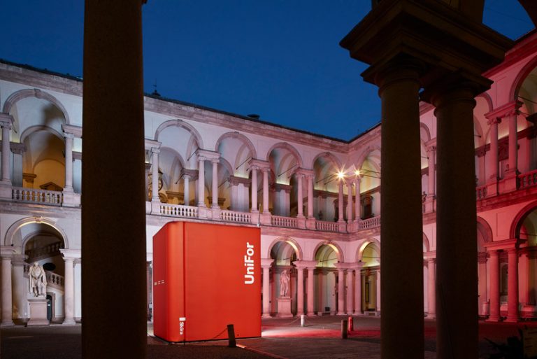 unifor exhibits a giant red book during milan design week