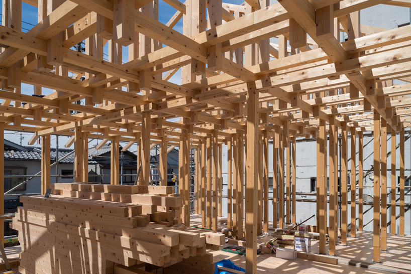 kazuya morita builds wooden lattice frame structure for archive library ...