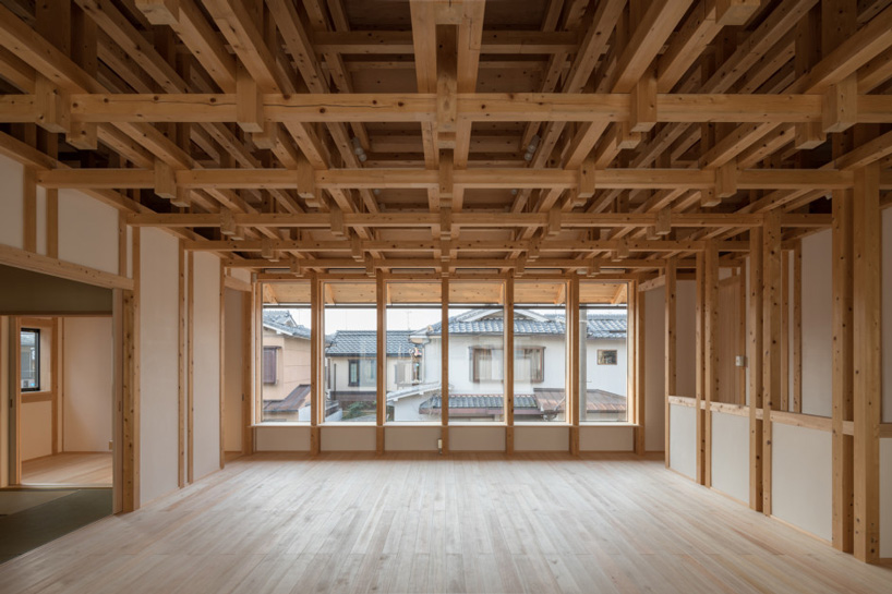 kazuya morita builds wooden lattice frame structure for archive library ...