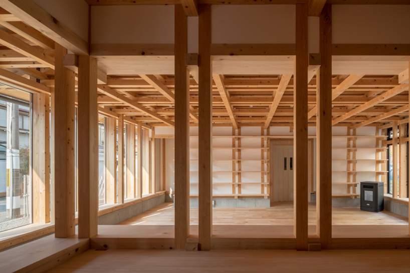 kazuya morita builds wooden lattice frame structure for archive library ...