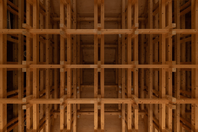 kazuya morita builds wooden lattice frame structure for archive library ...