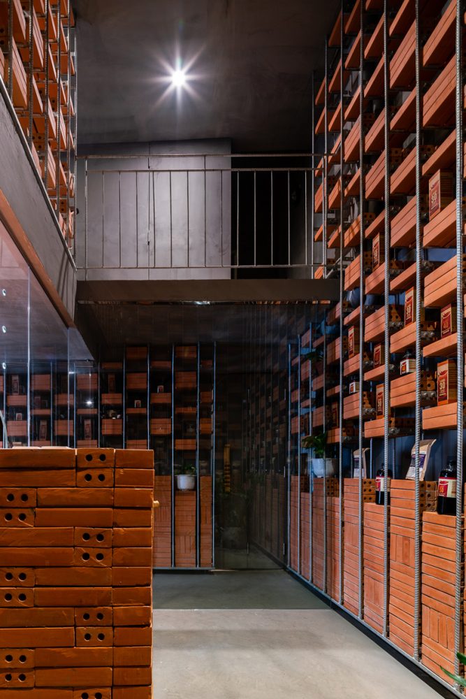 tropical space constructs vietnamese showroom with clay brick + metal ...
