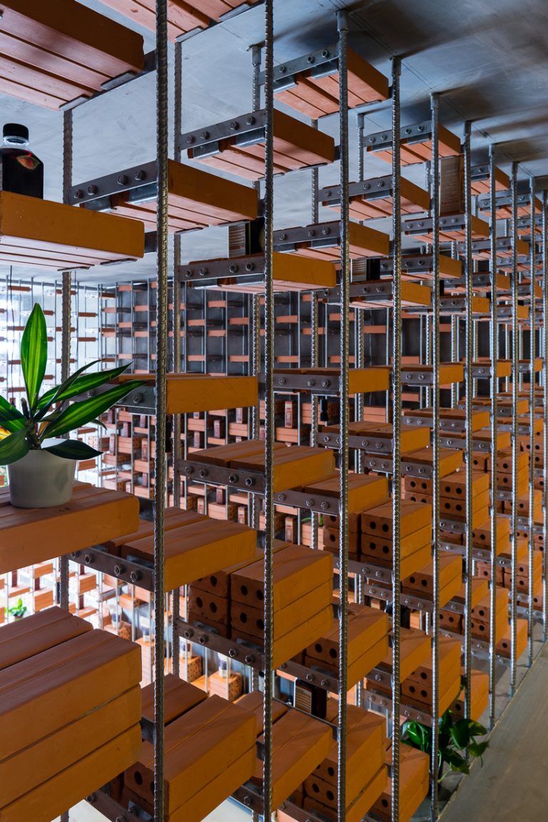 tropical space constructs vietnamese showroom with clay brick + metal ...