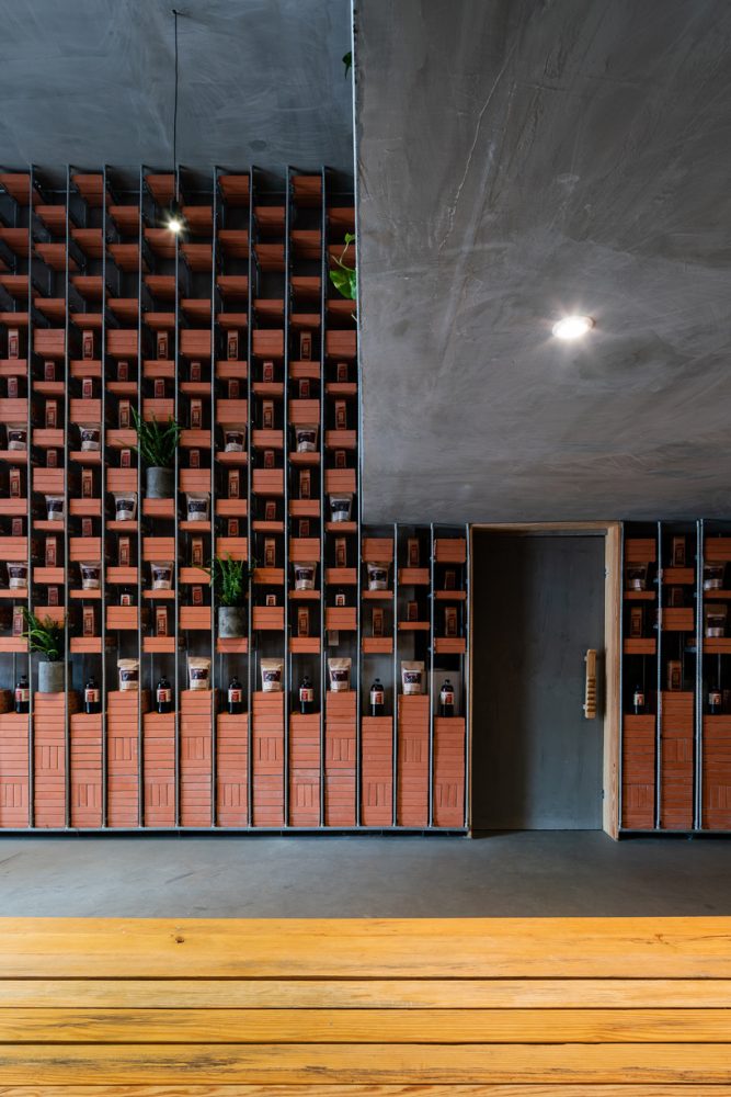 tropical space constructs vietnamese showroom with clay brick + metal ...