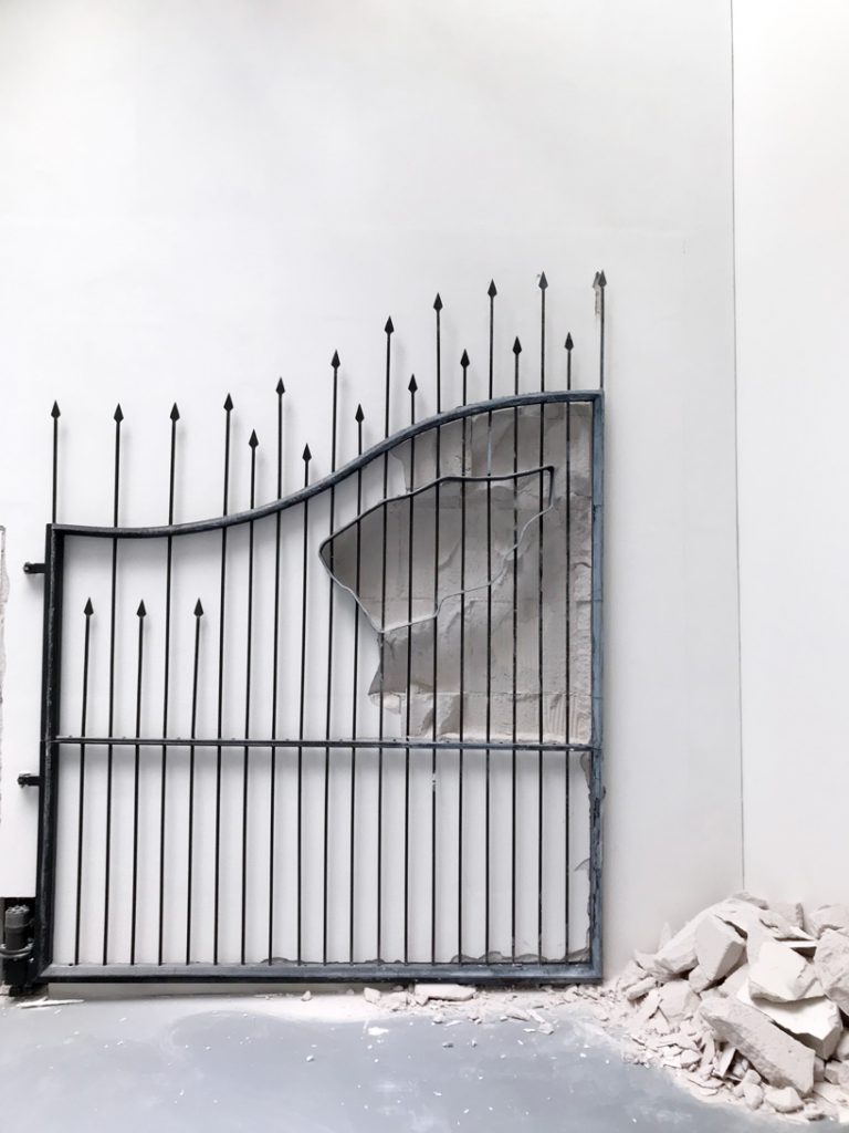shilpa gupta's metal gate continuously swings back and forth breaking ...